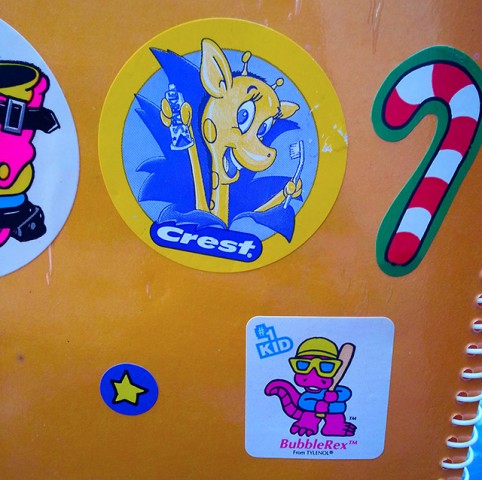 Someone's amazing old sticker album. | Dinosaur Dracula!